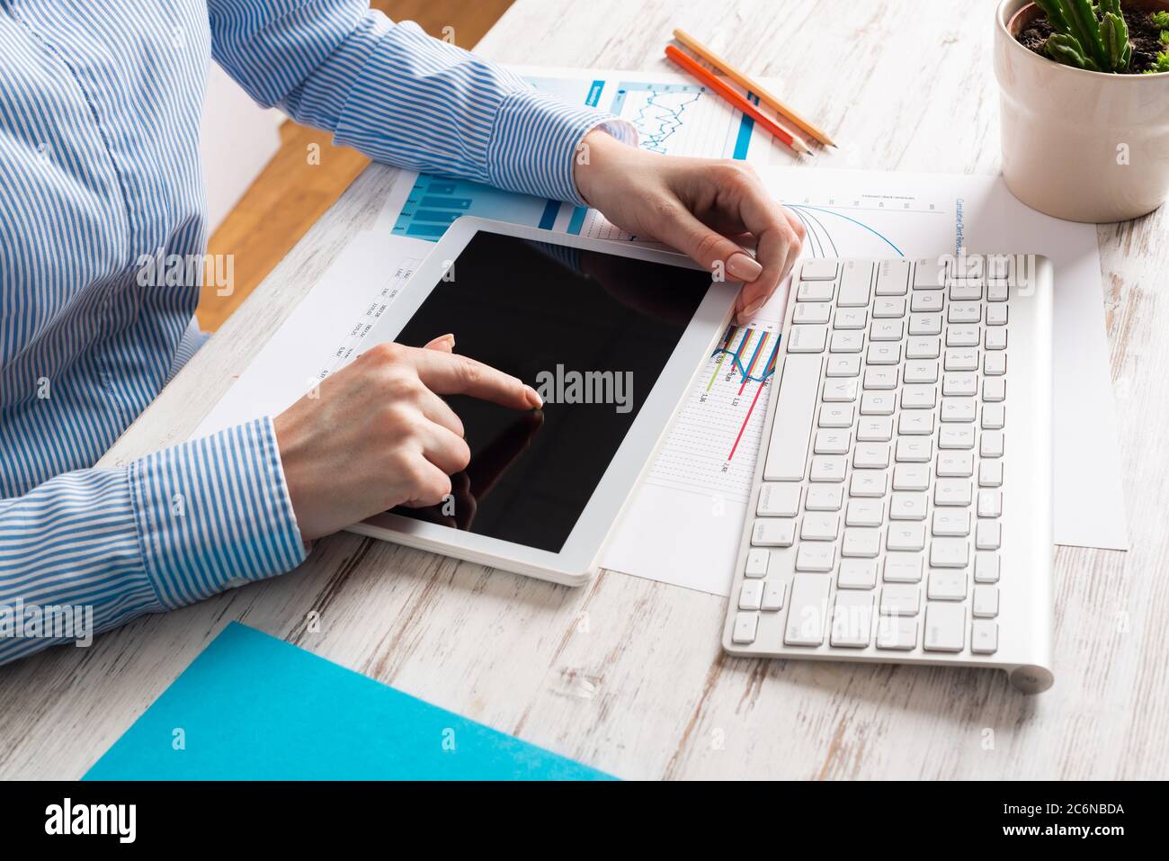 Manager using tablet computer with blank screen Stock Photo - Alamy