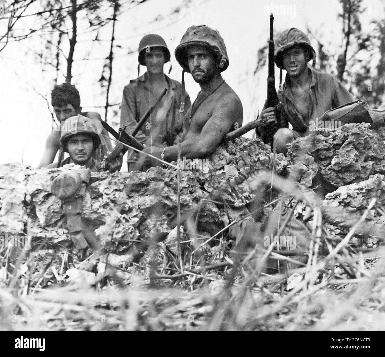 U.S. Marines stand in a foxhole near the front lines of combat on ...