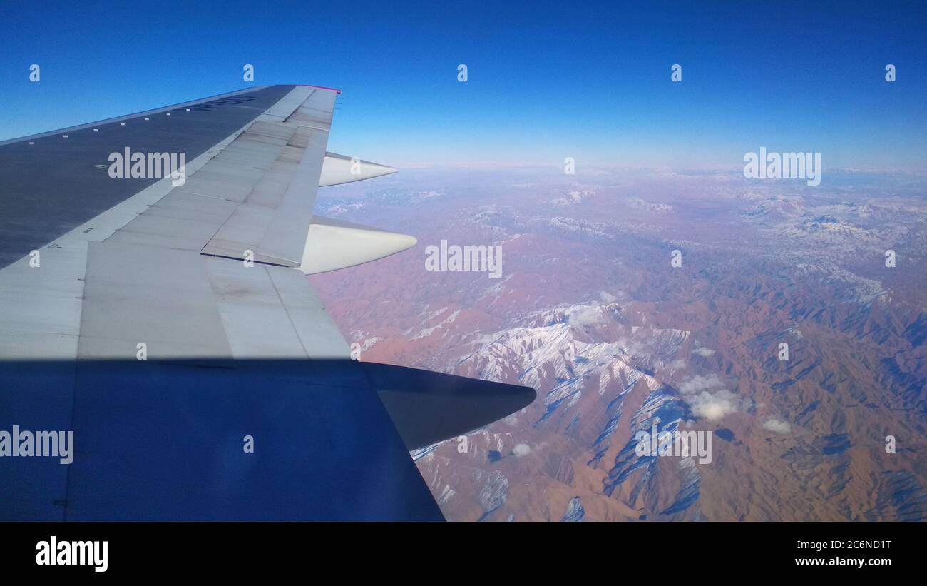 Airplane wing landscape. Airplane wing out of window Stock Photo - Alamy