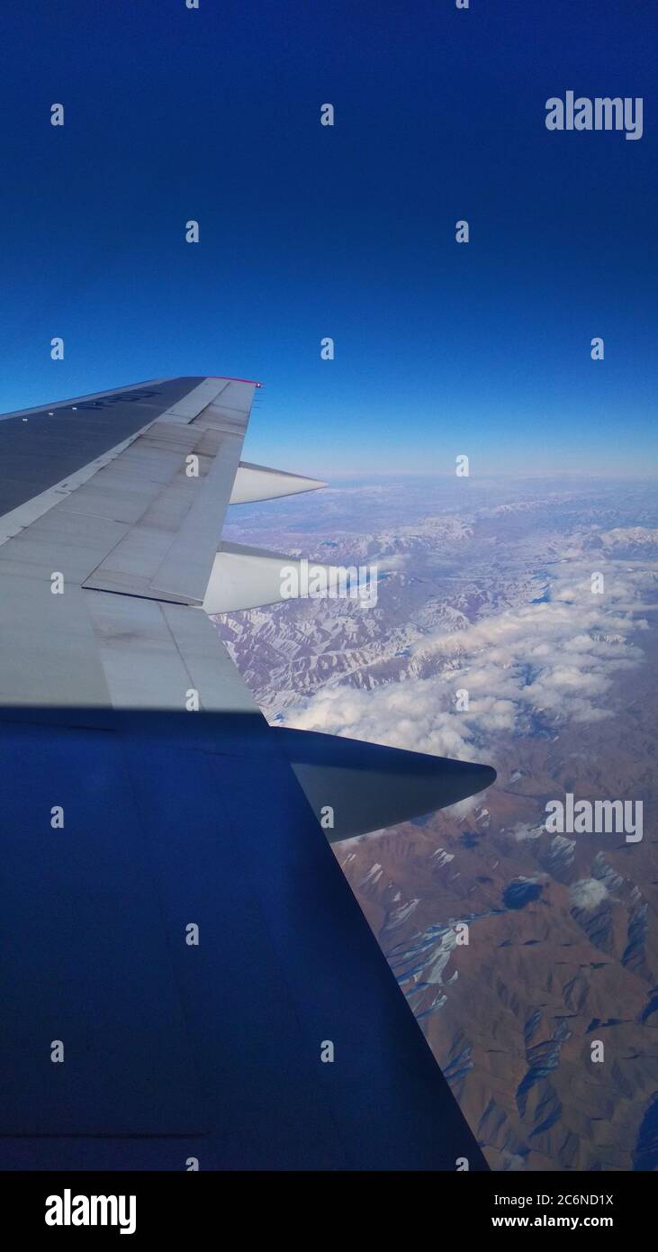 Airplane wing landscape. Airplane wing out of window Stock Photo - Alamy