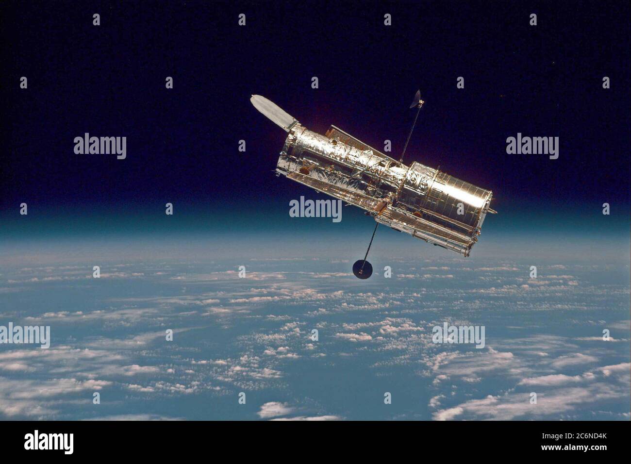 The Hubble Space Telescope hovers at the boundary of Earth and space in ...