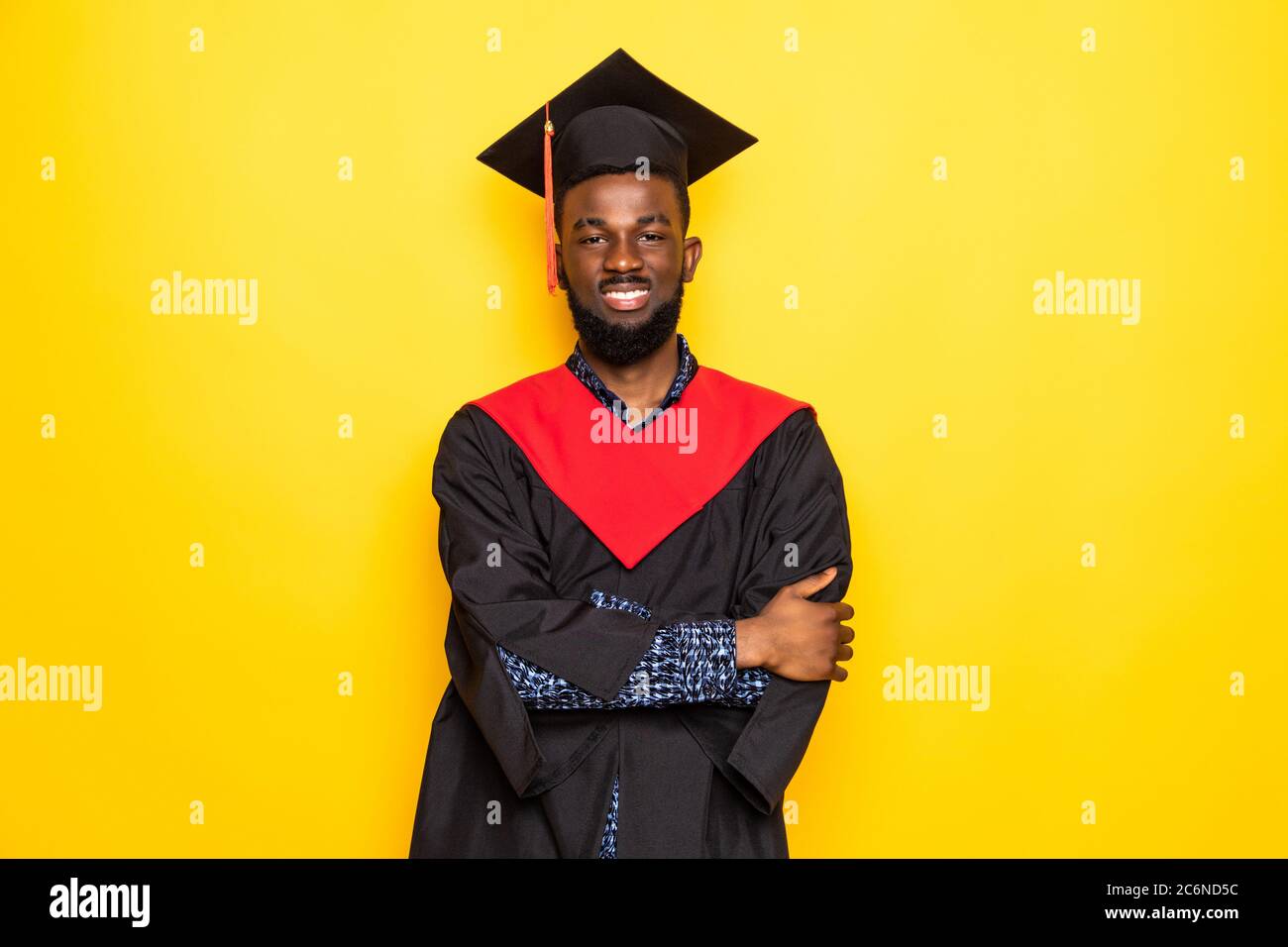 African American man college graduate on yellow background Stock Photo ...