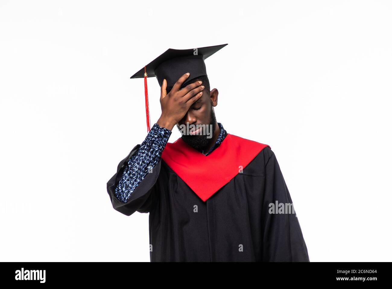 Young graduated african american man holding degree over isolated ...