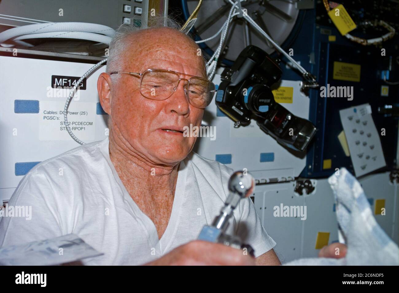 (31 Oct. 1998) --- U.S. Sen. John H. Glenn Jr., STS-95 payload specialist, is pictured with a ...