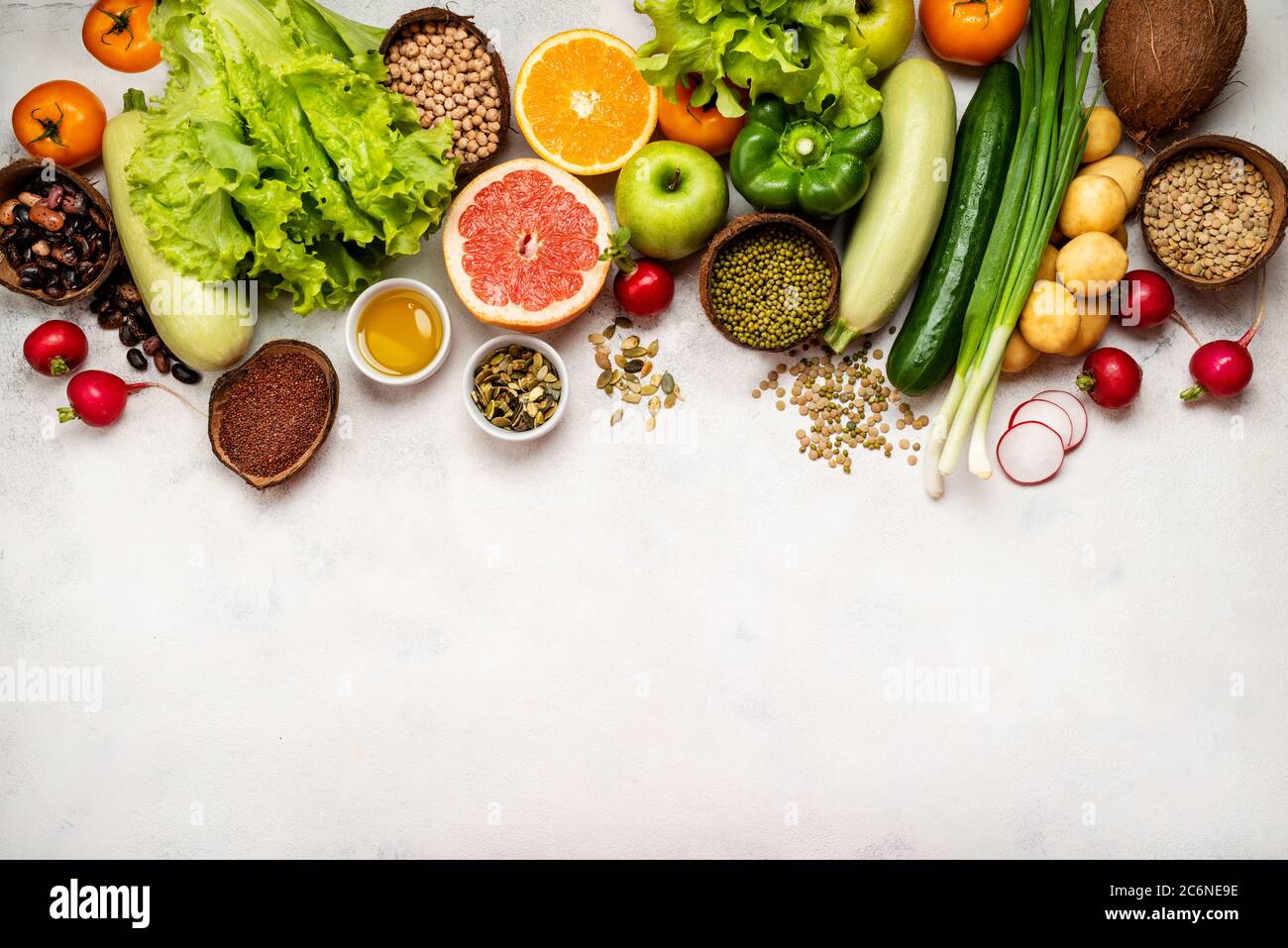 Vegan healthy food border on white background. Top view with place for ...