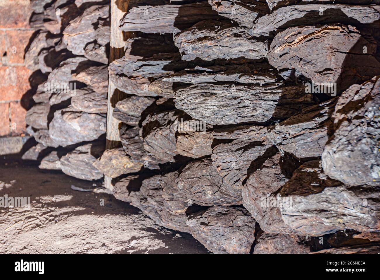 Storage of dry wooden coal, charcoal is piled and ready for ussage ...