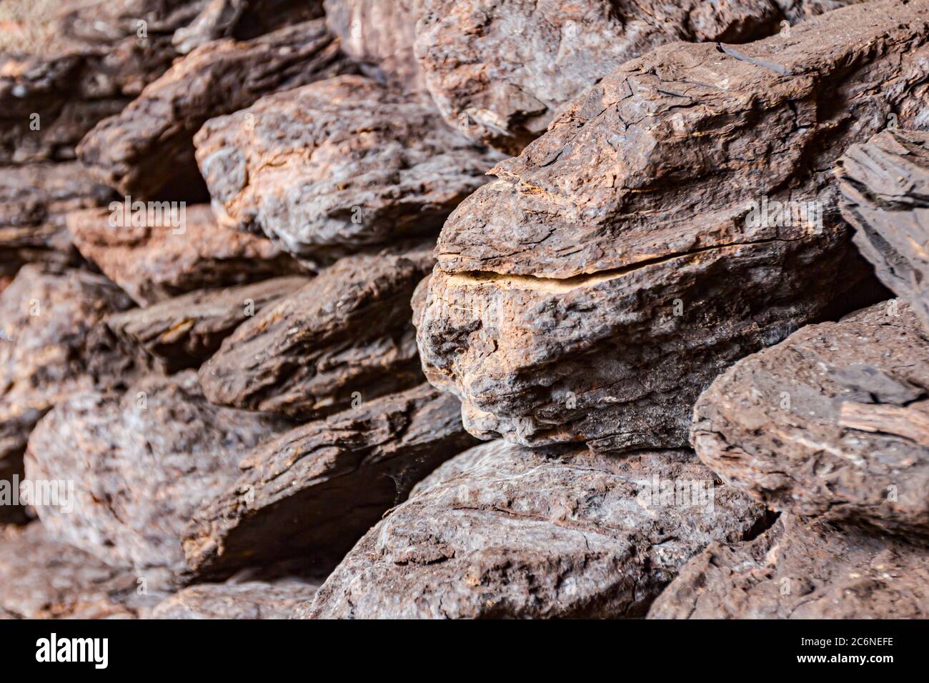 Storage of dry wooden coal, charcoal is piled and ready for ussage ...