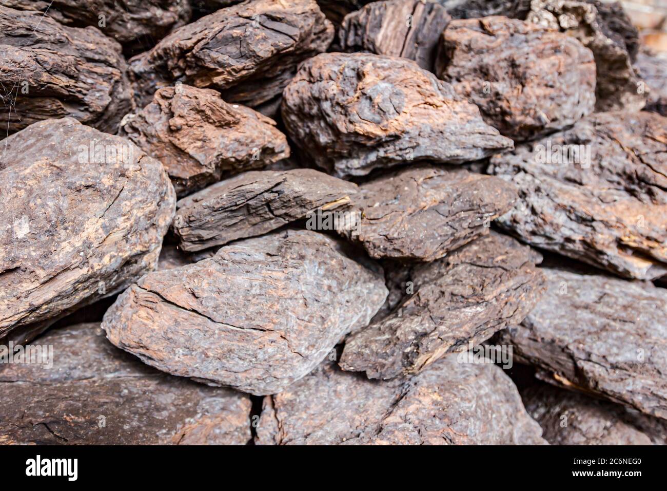 Storage of dry wooden coal, charcoal is piled and ready for ussage ...