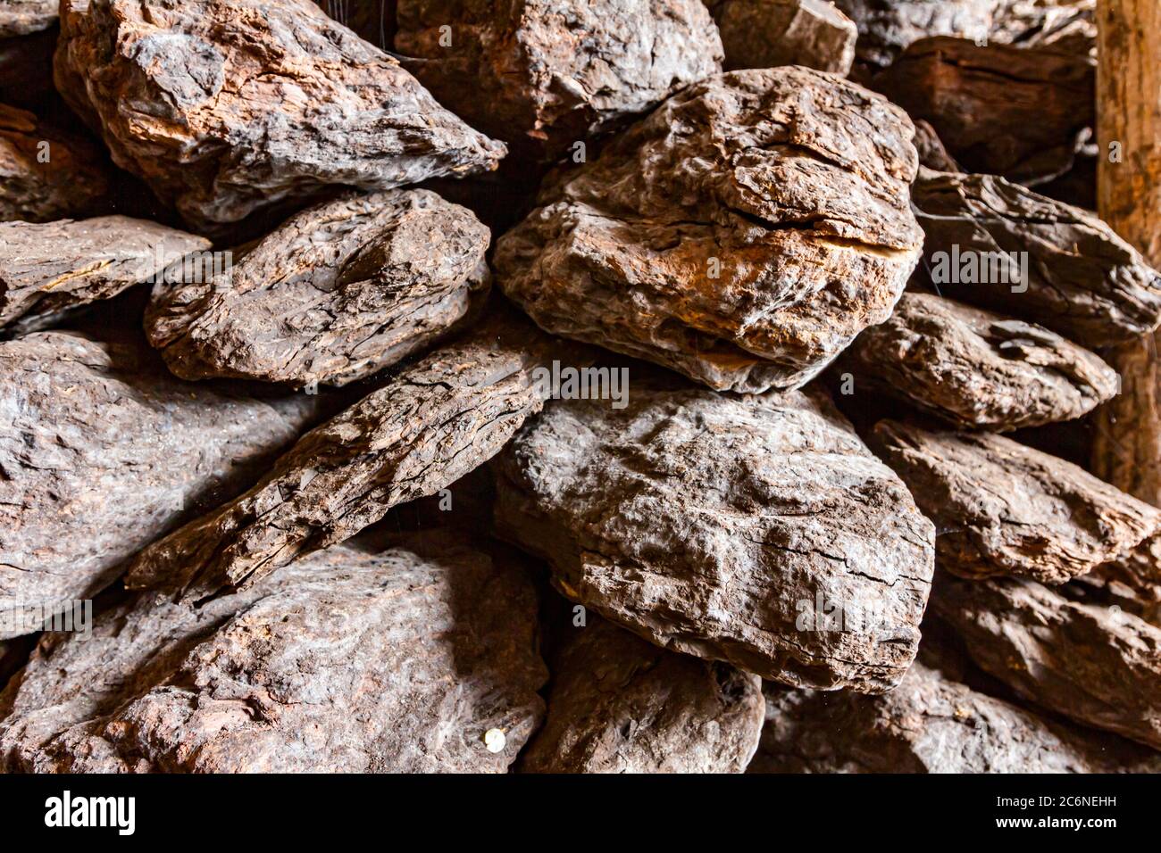 Storage of dry wooden coal, charcoal is piled and ready for ussage ...