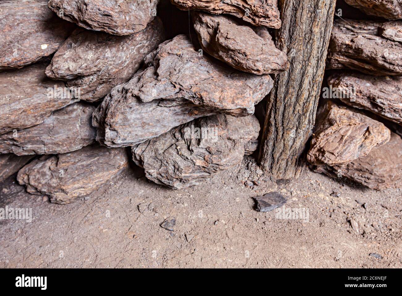 Storage of dry wooden coal, charcoal is piled and ready for ussage ...