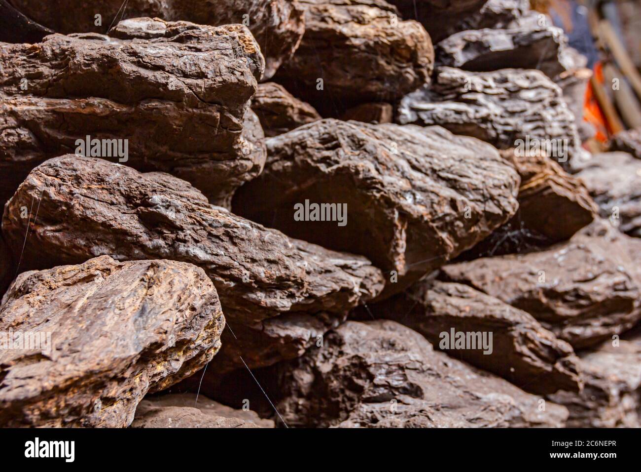 Storage of dry wooden coal, charcoal is piled and ready for ussage ...