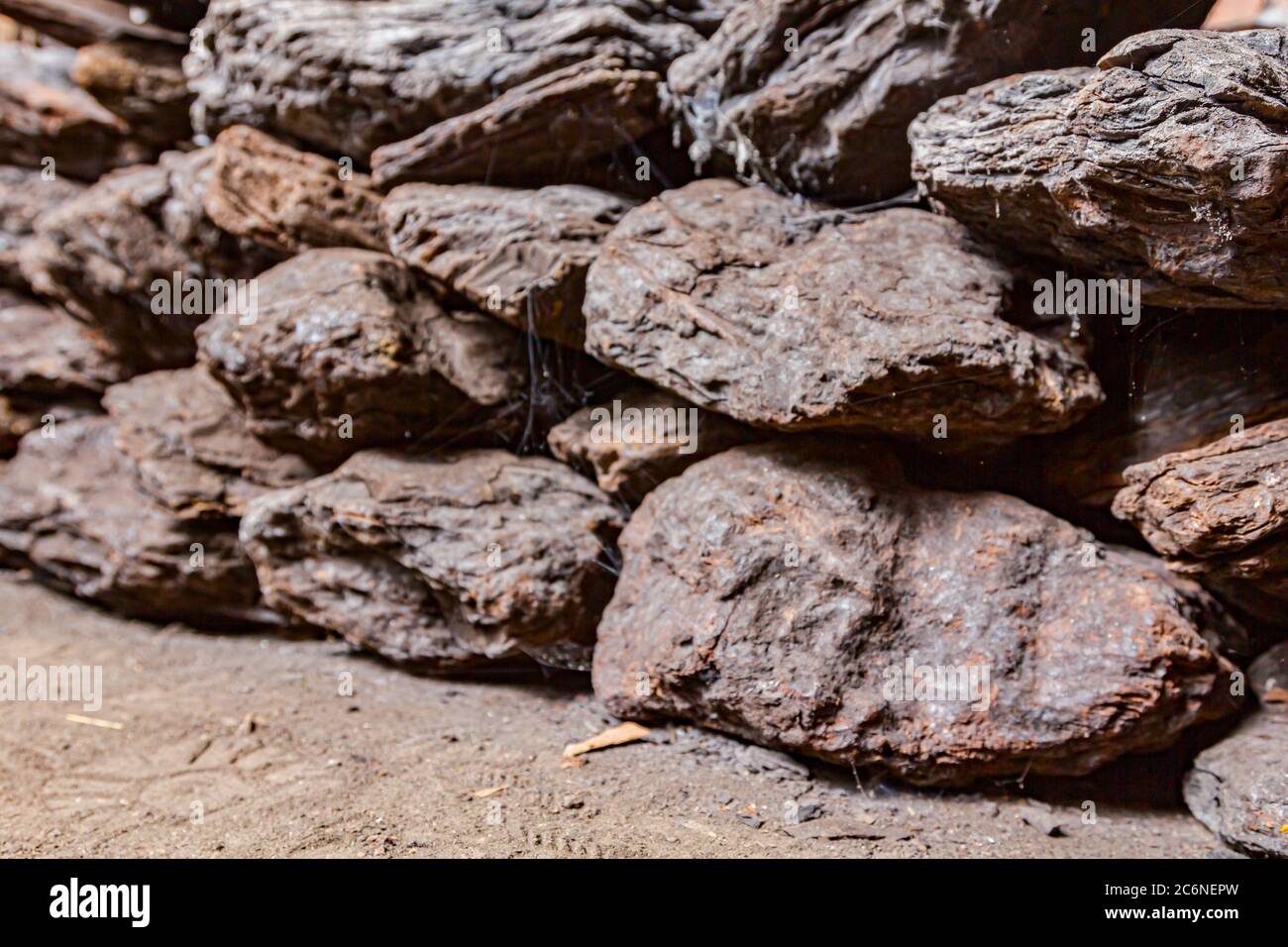 Storage of dry wooden coal, charcoal is piled and ready for ussage ...
