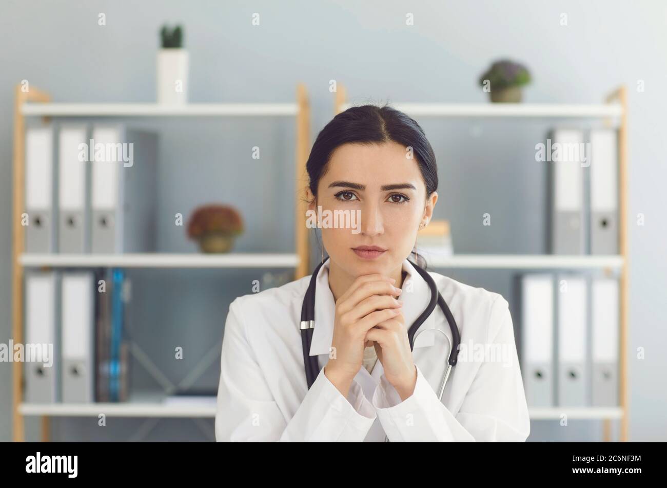 Serious female doctor in medical uniform in clinic Stock Photo - Alamy