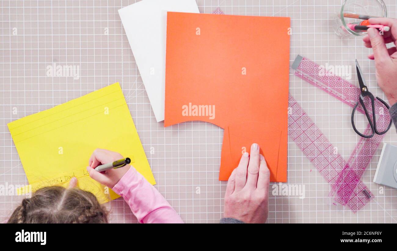 Flat lay. Little girl making a handmade Father's Day card from ...