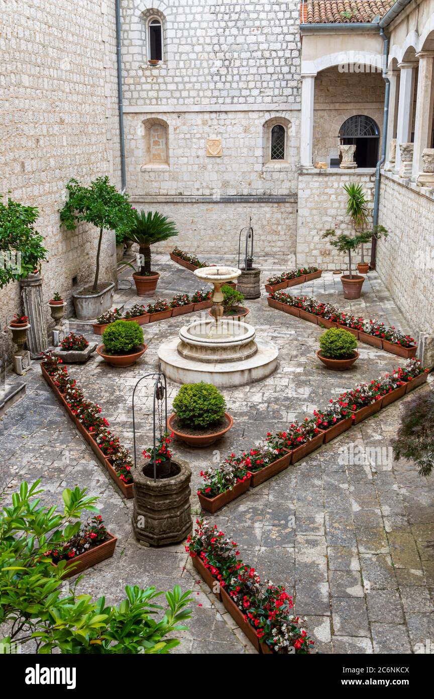View of interior patio of monastery in Rome Stock Photo - Alamy