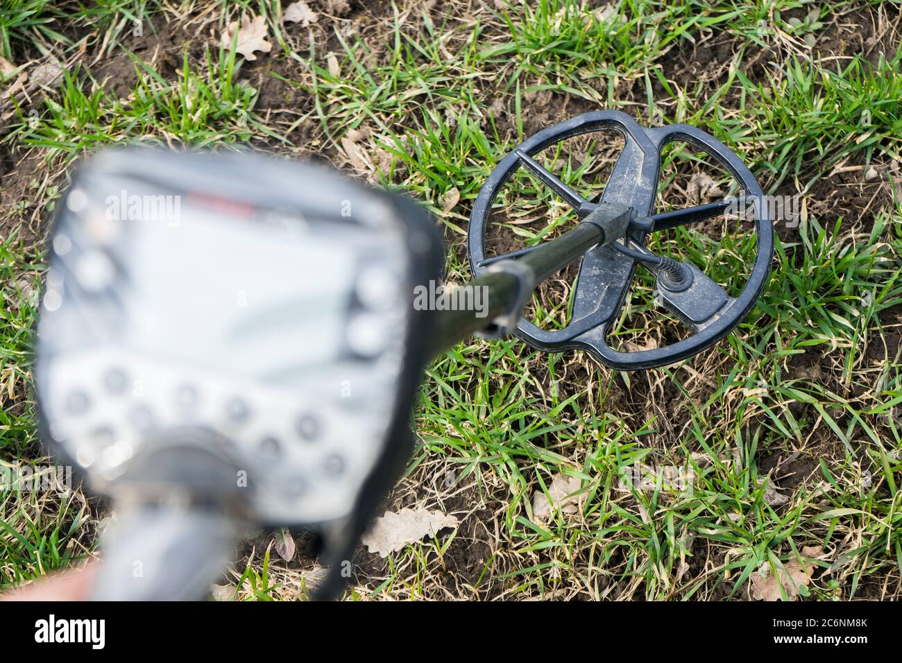 The metal detector in the hand from the first person. Search old coins ...