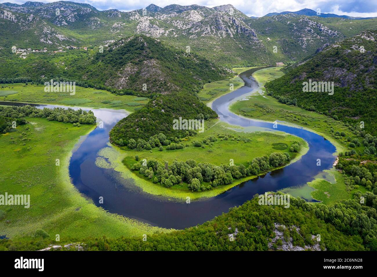 Aerial view of river bend of the river Rijeka Crnojevica and lake Skadar, view from the ...