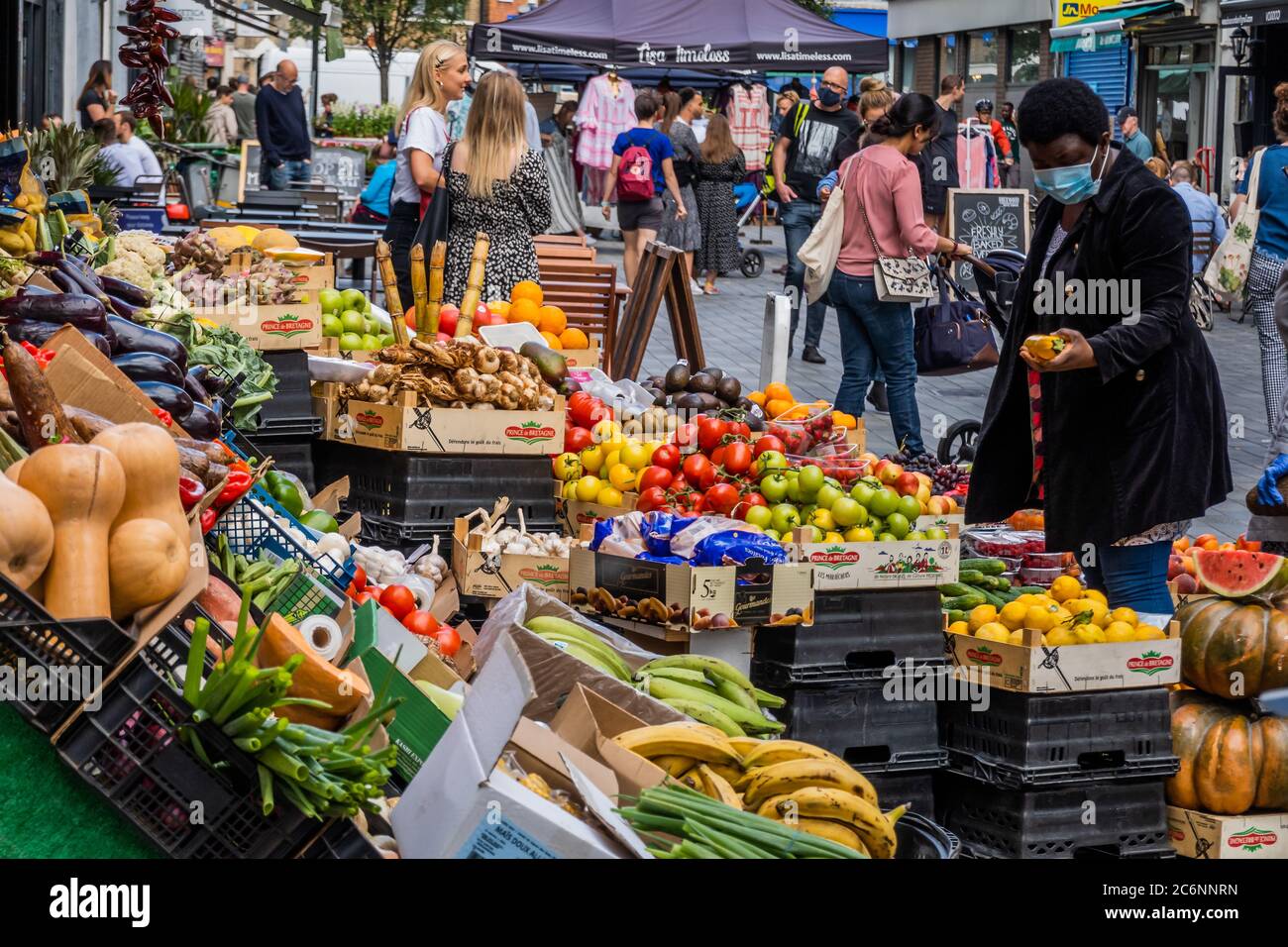London, UK. 11th July, 2020. The small market, food and veg shops and a ...