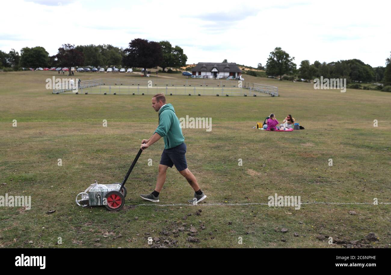 Groundsman Rob Hodder paints the boundary line at Lyndhurst & Ashurst ...