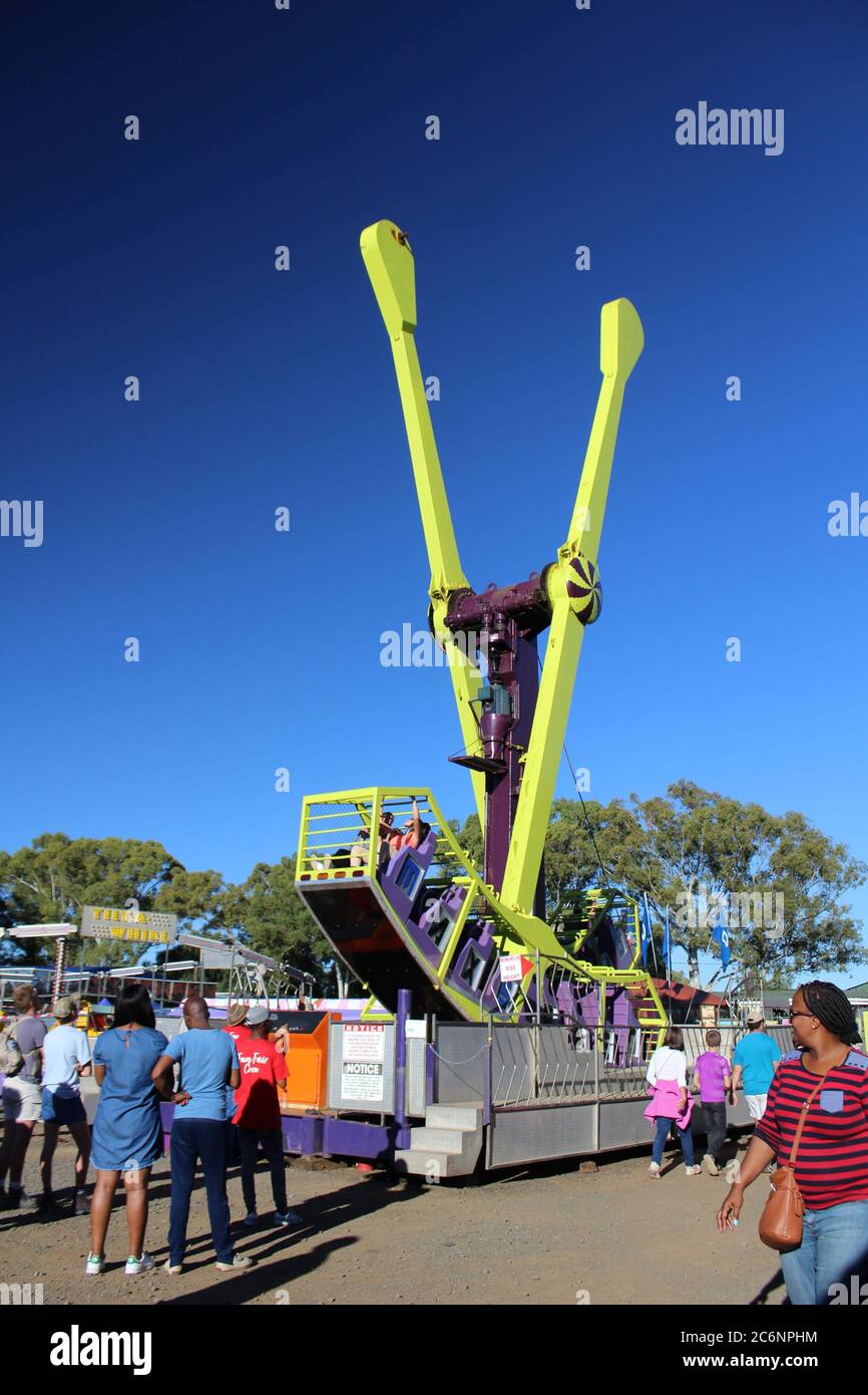 Amusement ride - the Looping Starship in a park full of people Stock ...