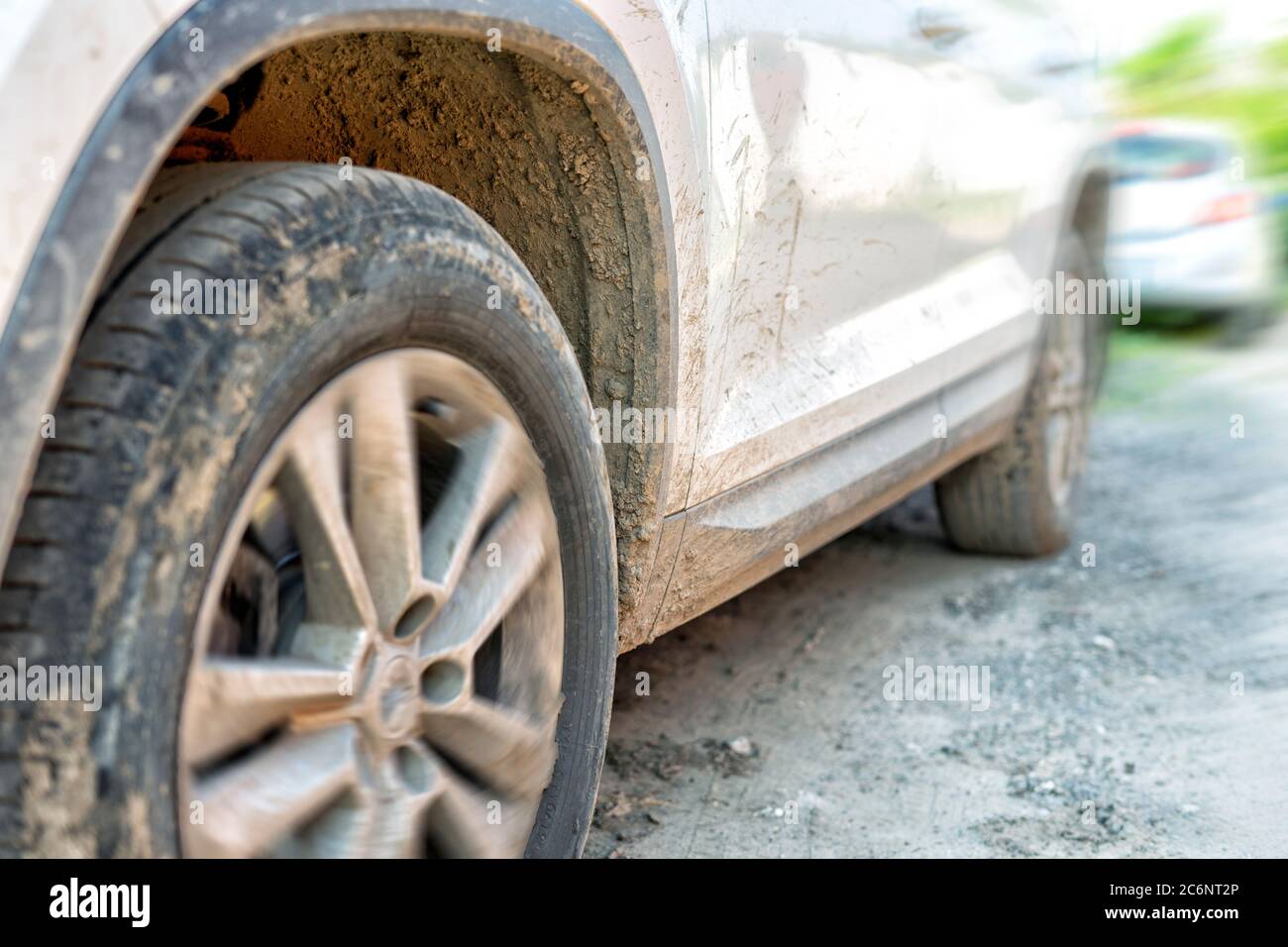 wheel of a dirty off-road vehicle in motion Stock Photo - Alamy