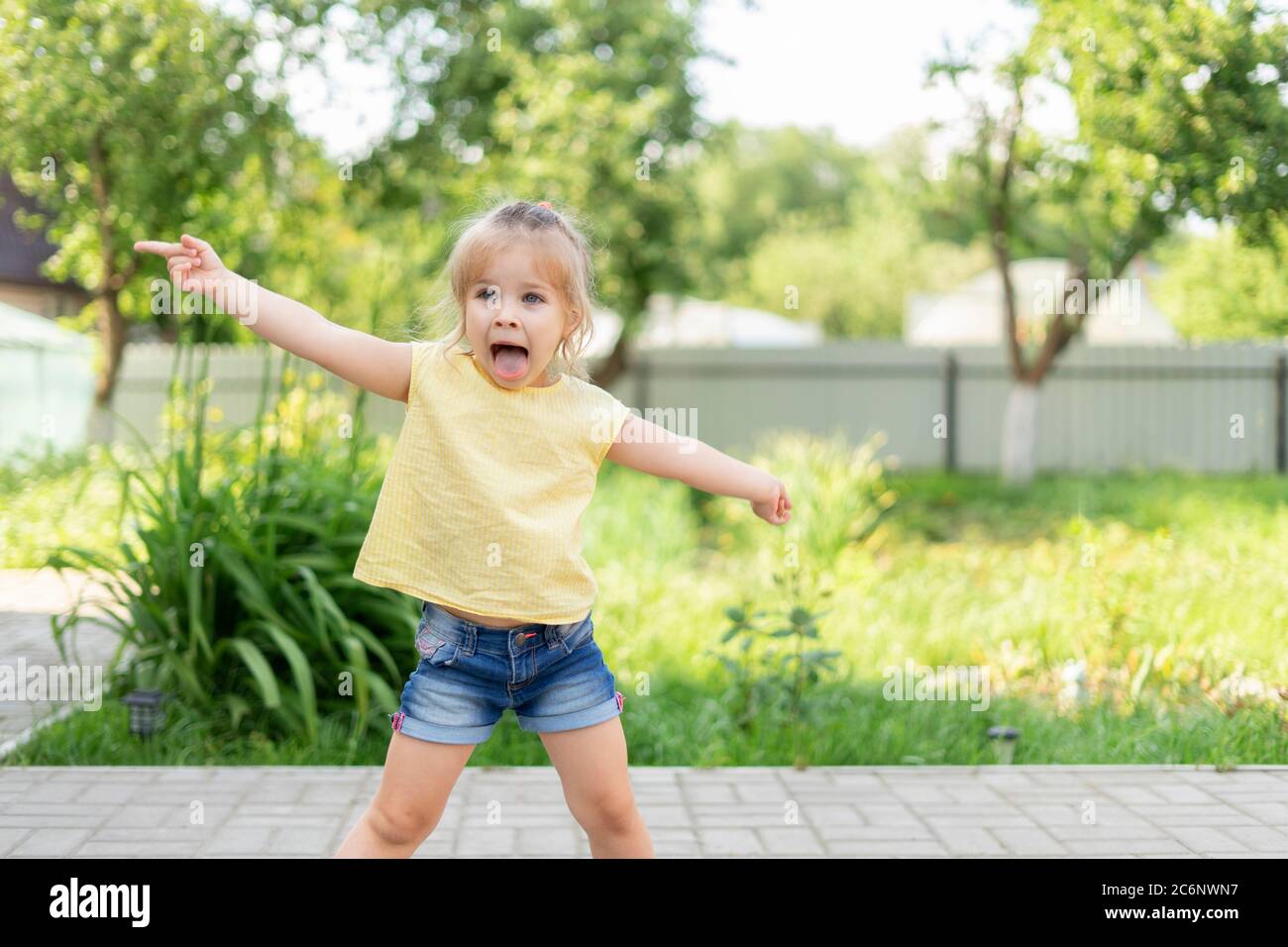 Little girl dances in the country. child dancing in nature Stock Photo ...