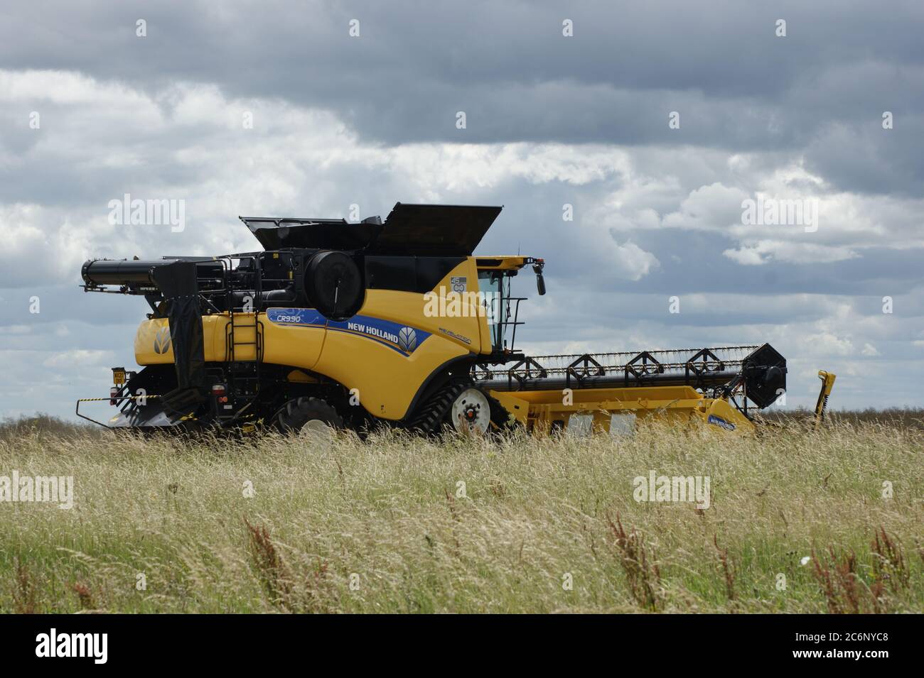 Combine Harvester in field Stock Photo - Alamy