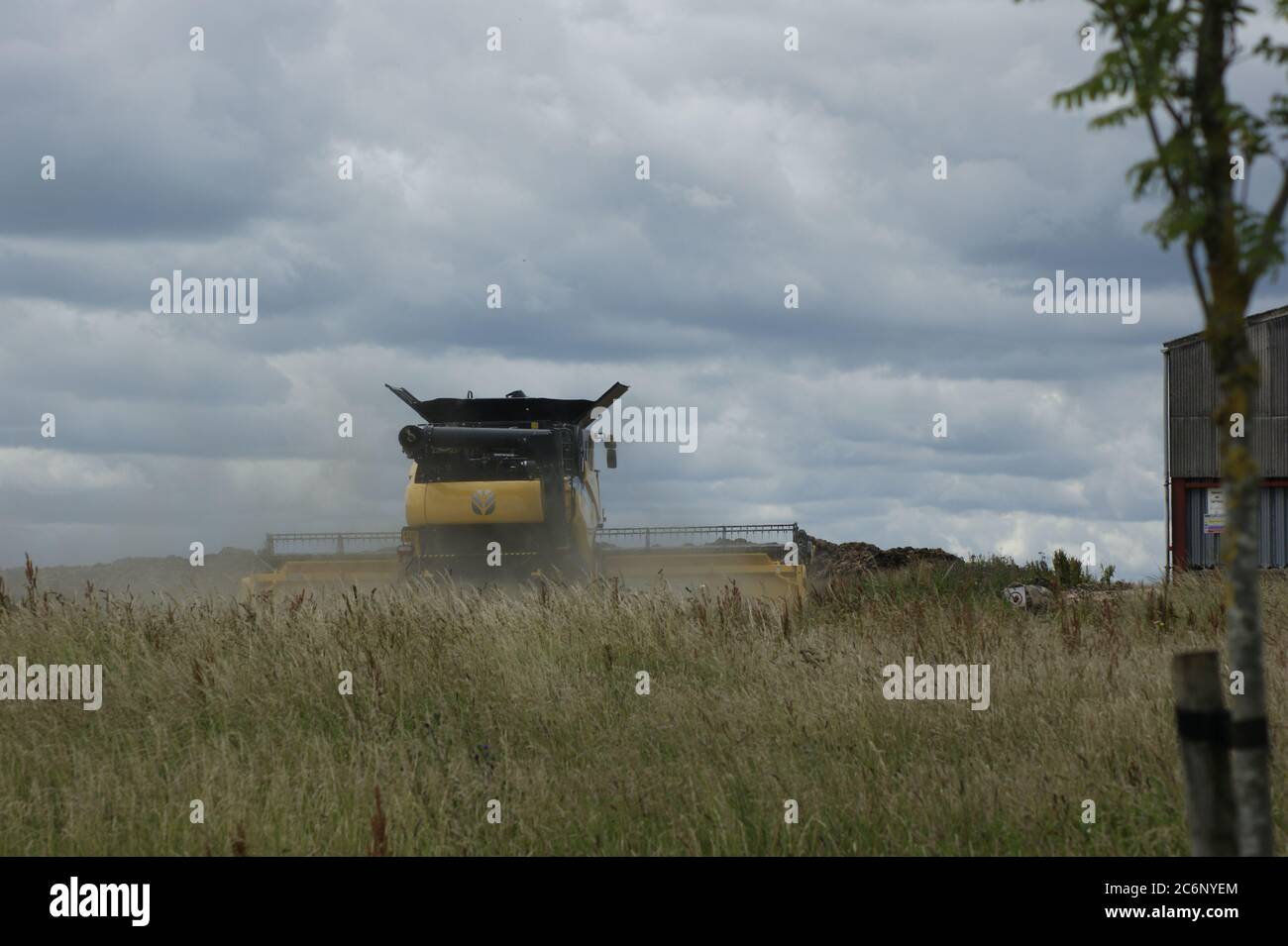 Combine Harvester in field Stock Photo - Alamy