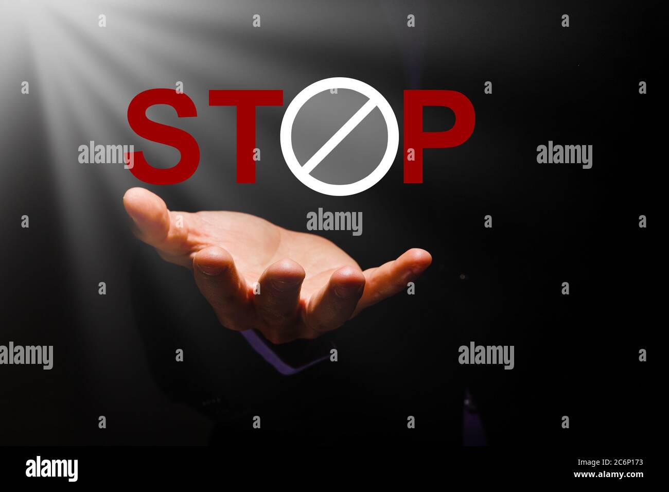 Hand raised with stop sign painted in the dark Stock Photo - Alamy
