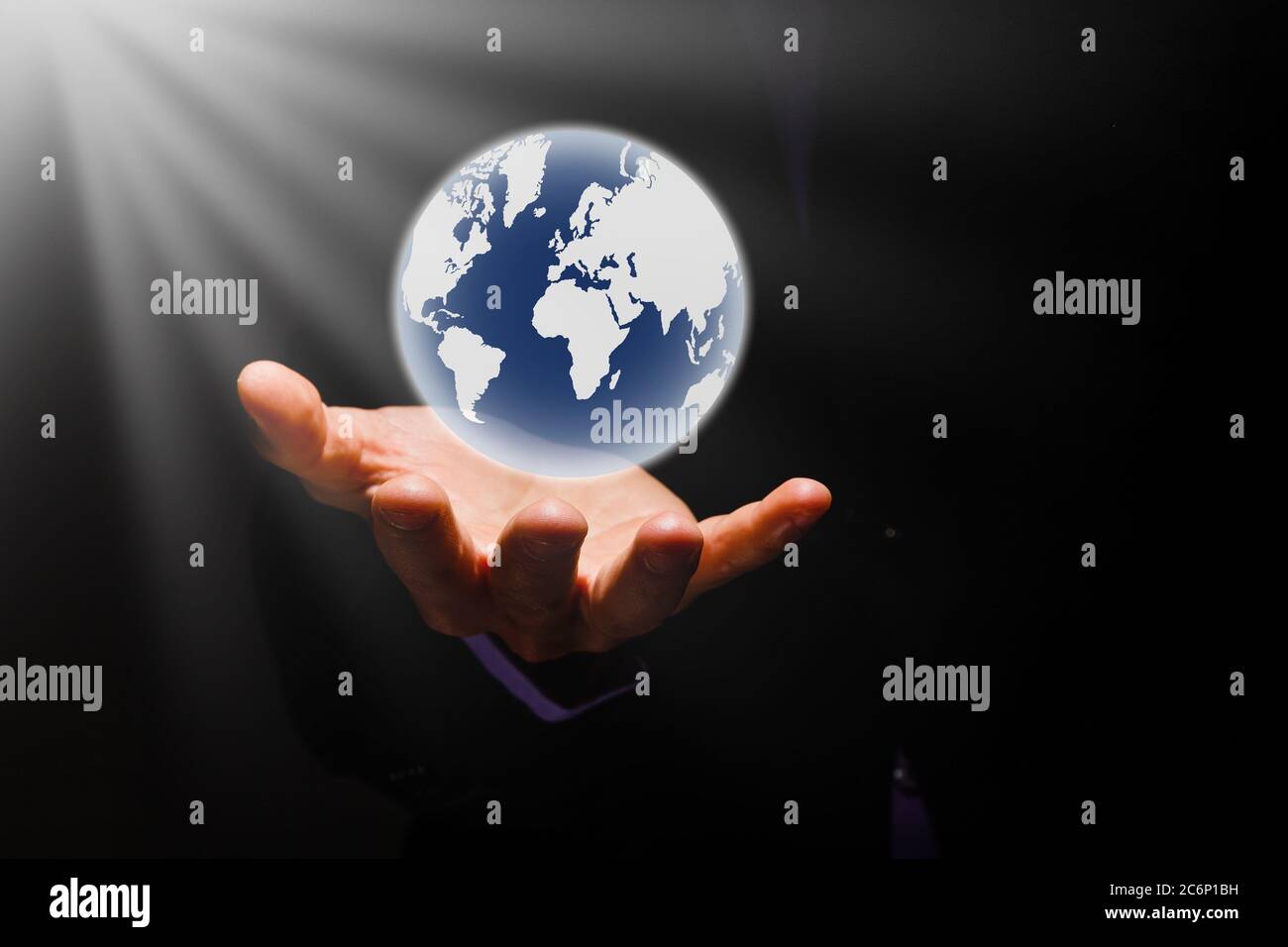 holding a glowing earth globe in his hands Stock Photo - Alamy