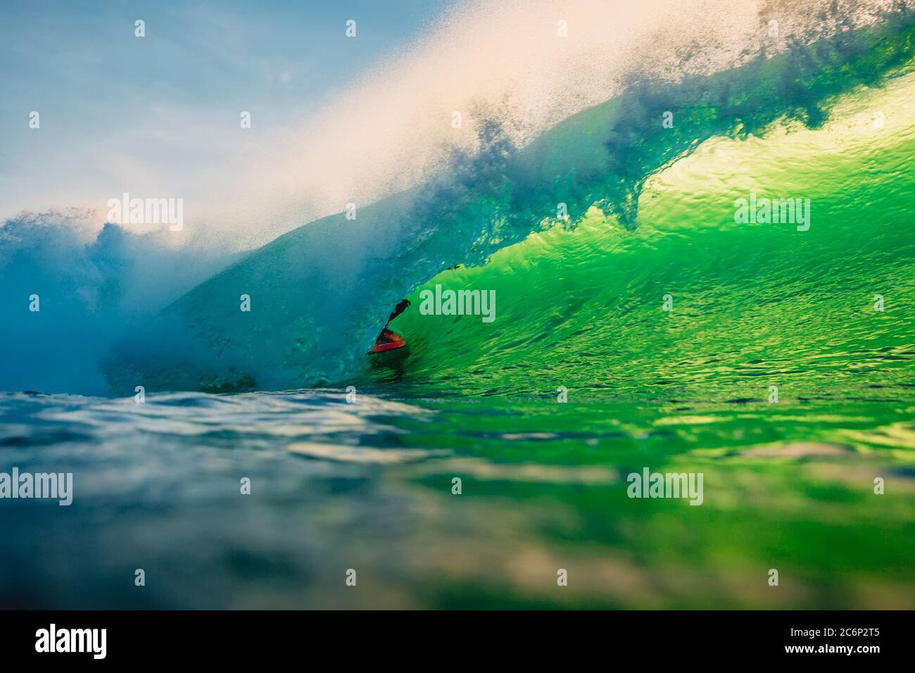 July 29, 2018. Bali, Indonesia. Surfer ride on barrel wave ...