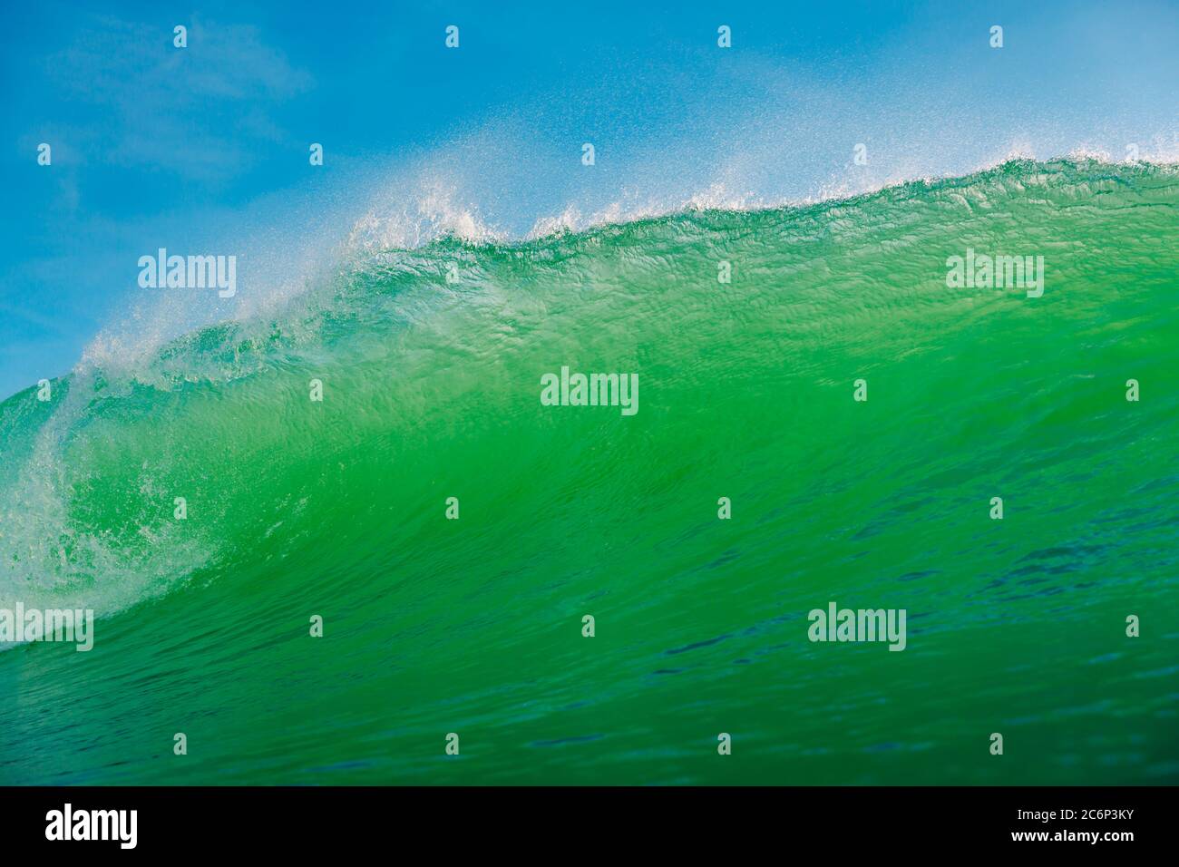 Big green wave in ocean. Breaking wave in Bali Stock Photo - Alamy