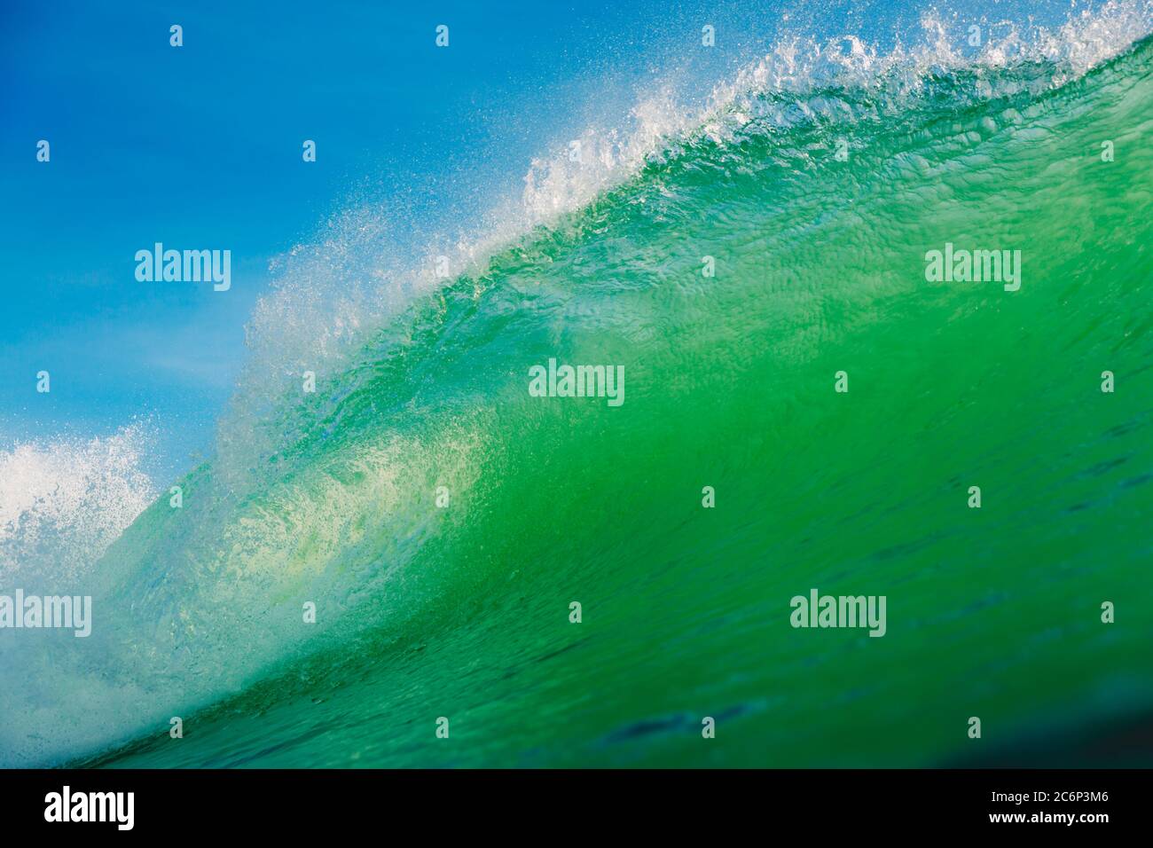 Big green wave in ocean. Breaking wave in Bali Stock Photo - Alamy