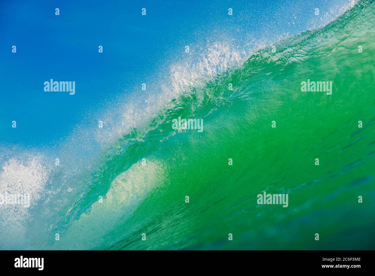 Big green wave in ocean. Breaking wave in Bali Stock Photo - Alamy