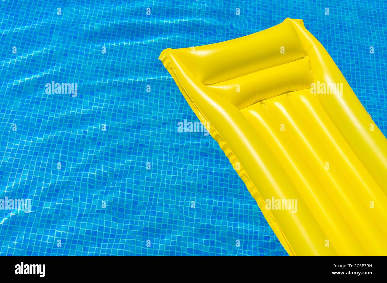 Swimming pool summer holiday background with yellow inflatable air ...