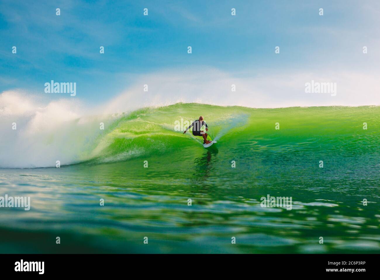 April 24, 2019. Bali, Indonesia. Surfer ride on barrel wave ...