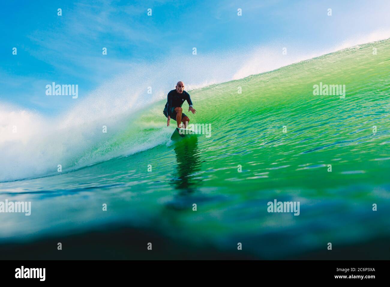 April 24, 2019. Bali, Indonesia. Surfer ride on barrel wave ...