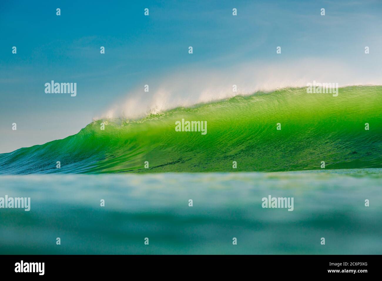 Big green wave in ocean. Breaking wave in Bali Stock Photo - Alamy