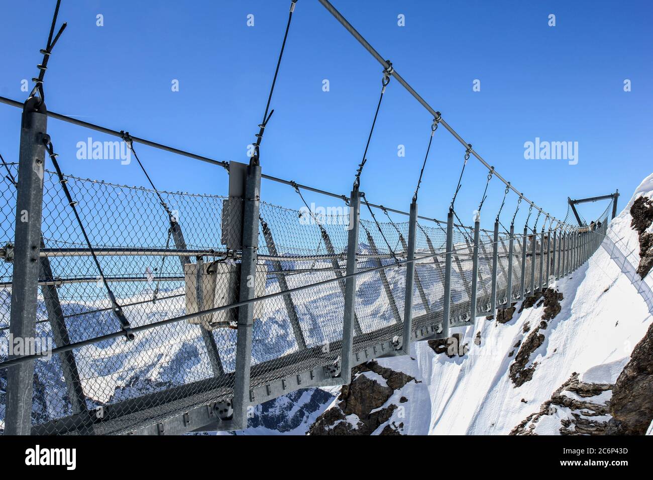 Hanging bridge on Titlis mountain cliff in Switzerland. The highest ...