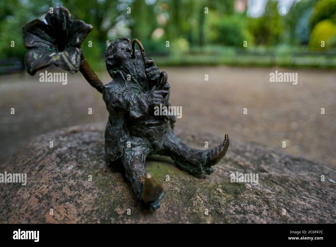 Dwarf playing trombone Botanical gardens in June Wroclaw Lower Silesia ...