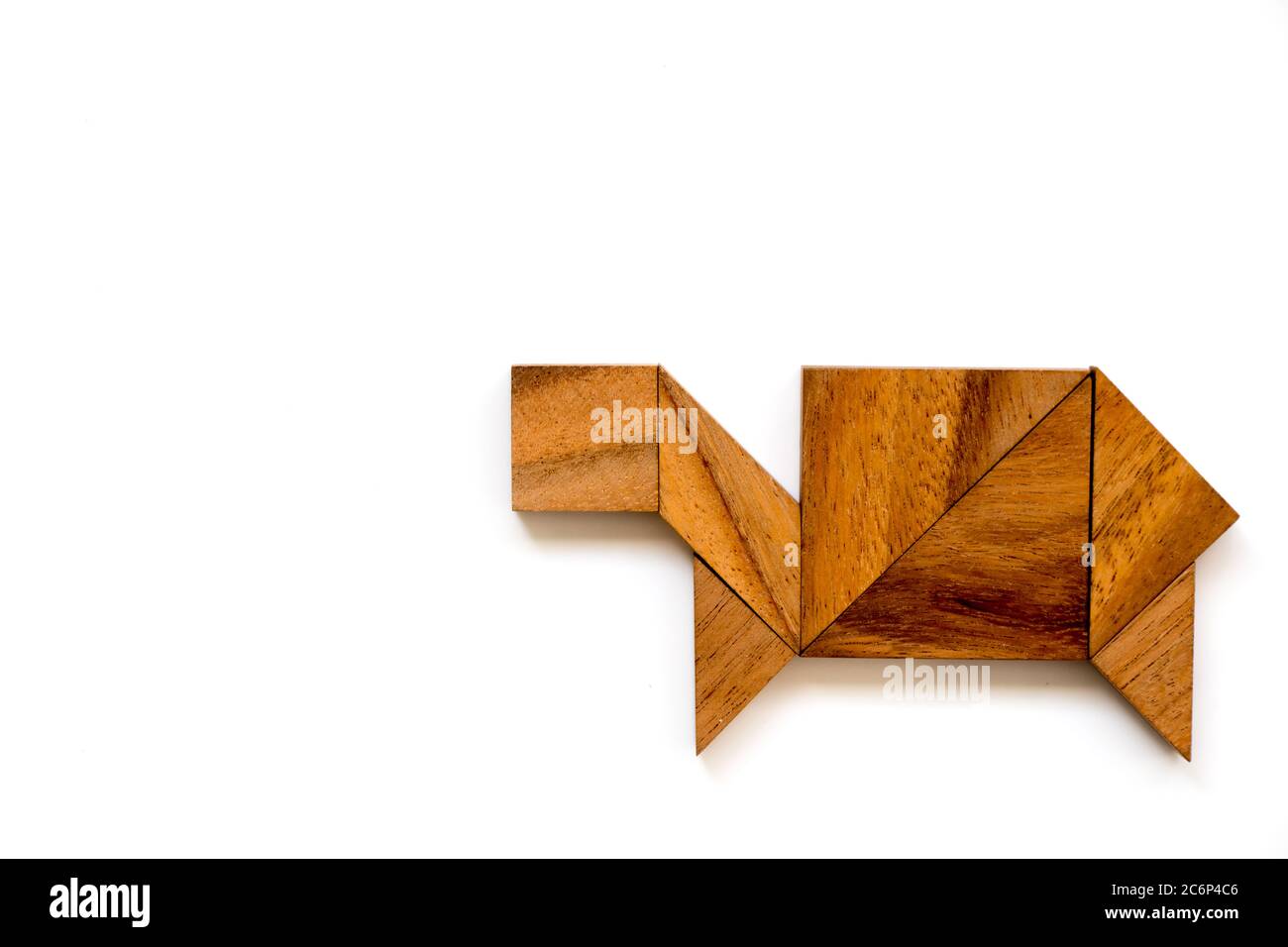 Wood tangram puzzle in turtle or tortoise shape on white background ...