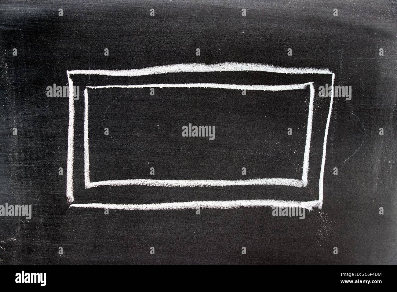 white chalk drawing in blank square shape on blackboard background ...