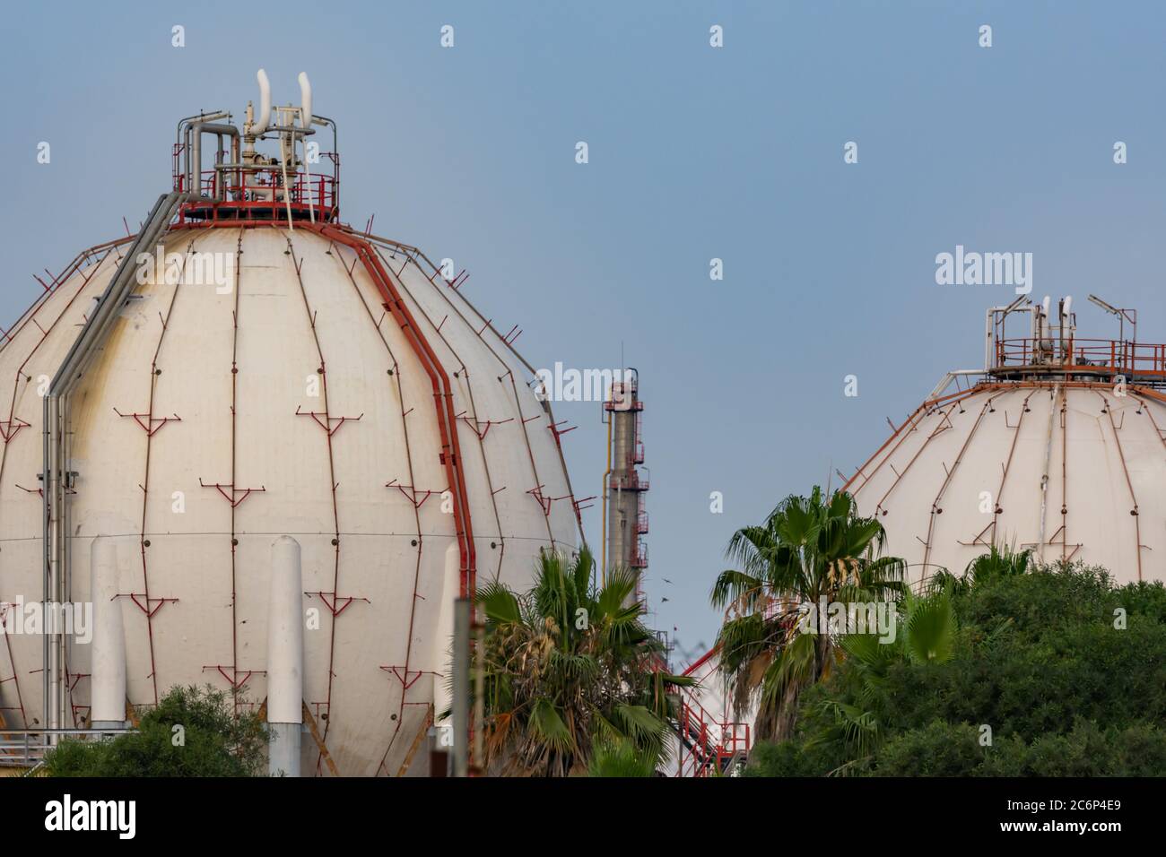 Specific round tanks for gas storage in a refinery Stock Photo - Alamy