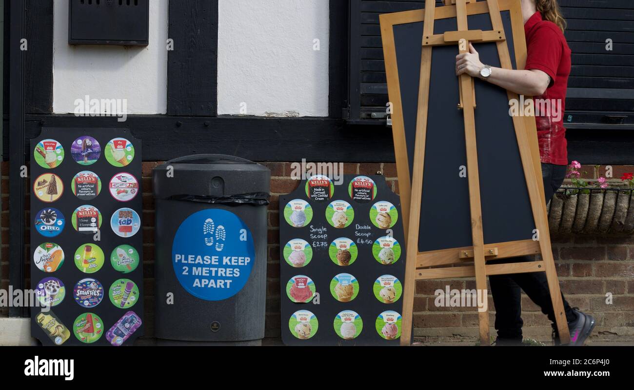 11 July 2020 - England, UK: Social distancing sign with icecream ads ...