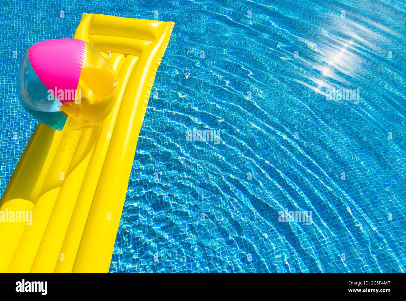 Summer holiday background, yellow inflatable air-bed and colorful beach ...