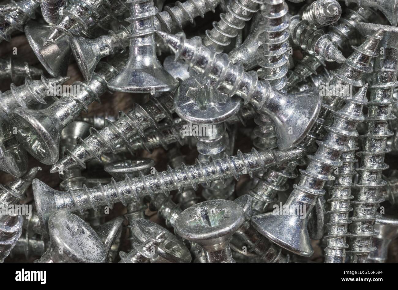 Background texture of many silver colored screws Stock Photo - Alamy