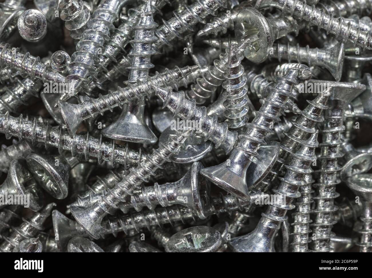 Close-up of screws heap, work tool background texture Stock Photo - Alamy