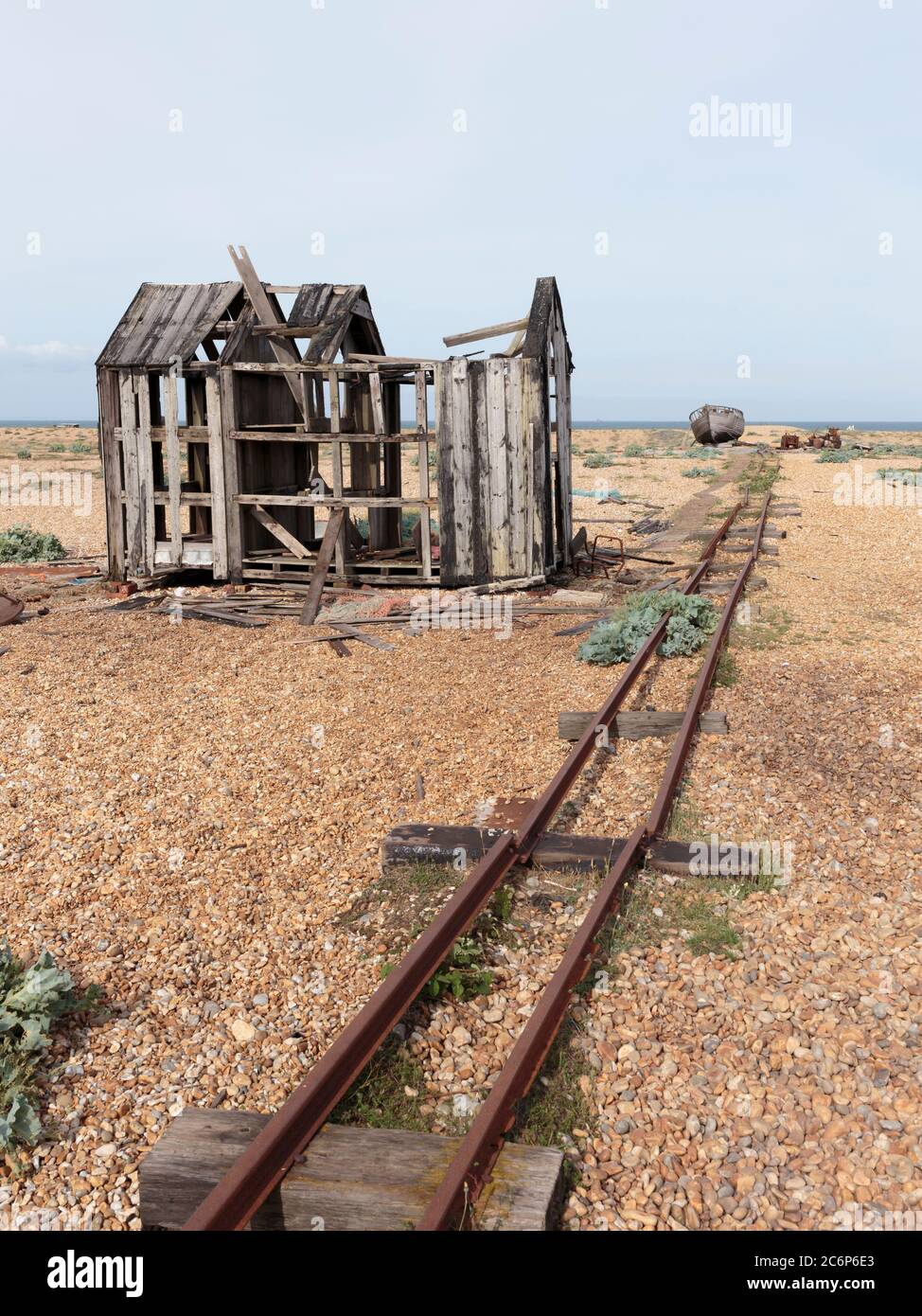 The runins of a wodden shack, narrow gauge rail tracks and the hull of ...