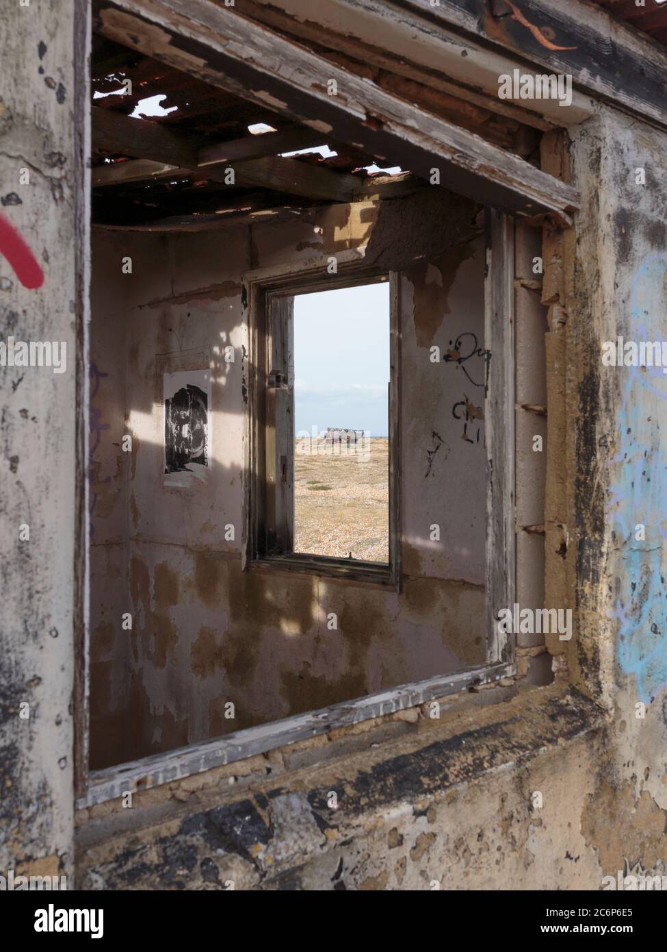 The runins of an old shack with the hull of an abandoned fishing boat ...