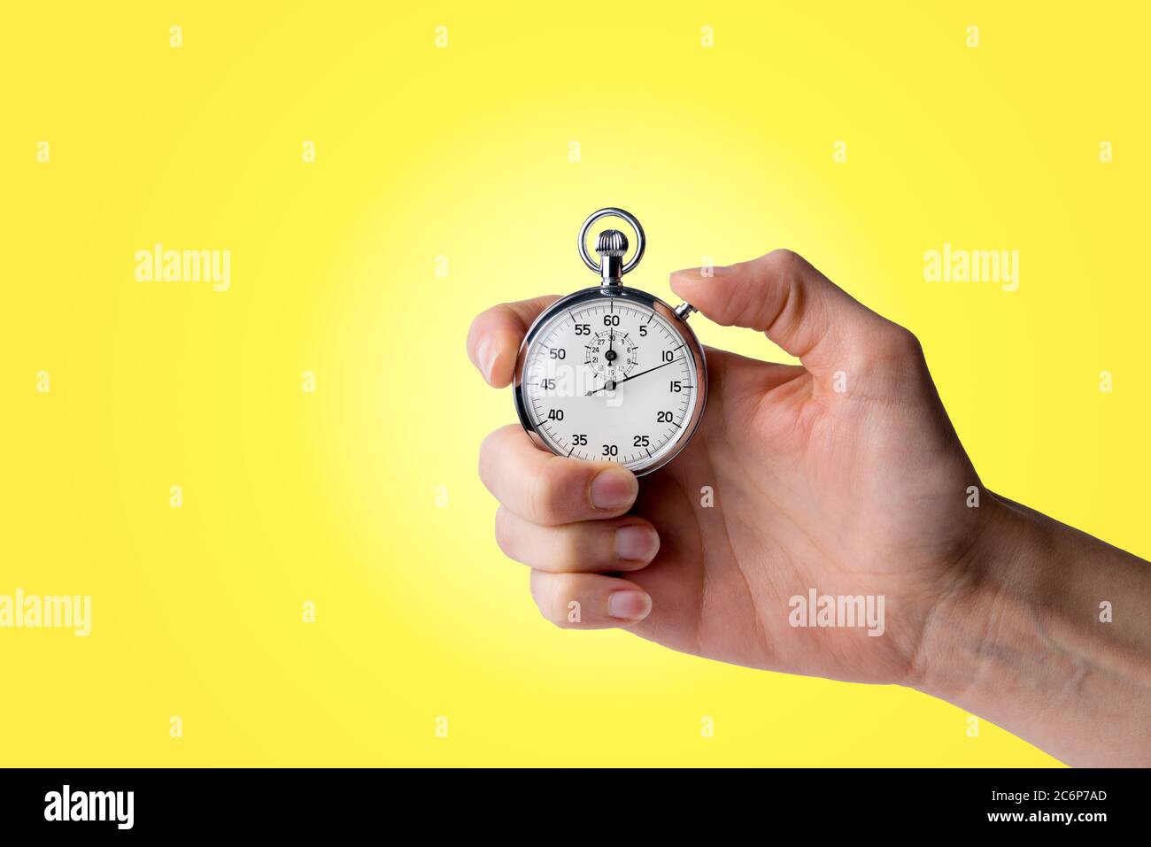 stopwatch hold in hand, button pressed Stock Photo - Alamy